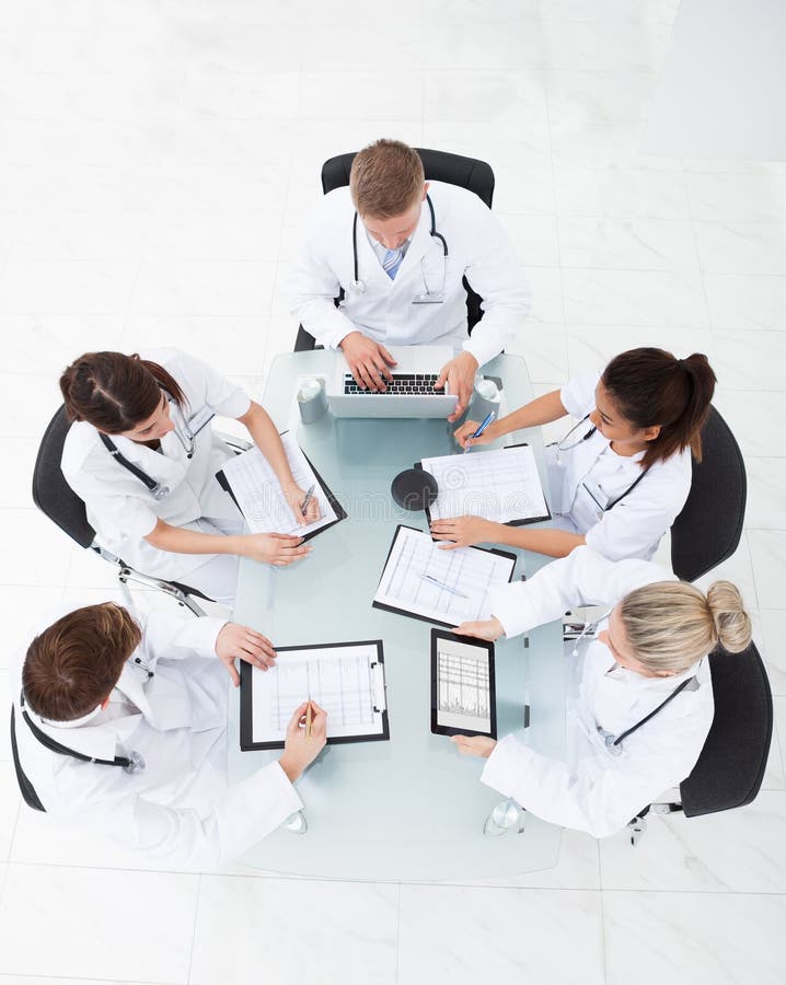 Doctors Analyzing Medical Records Stock Image - Image of clipboard ...