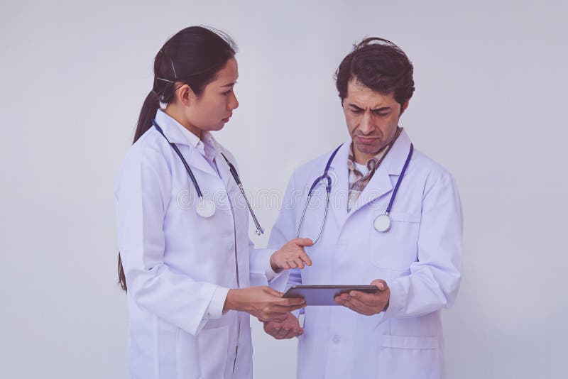 Doctors Checking Patient Information on a Tablet Device Stock Photo ...