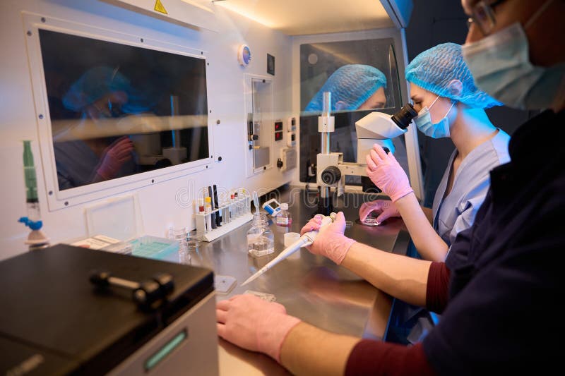 Doctors Conducting a Synchronized Procedure in a Sterile Lab Stock ...