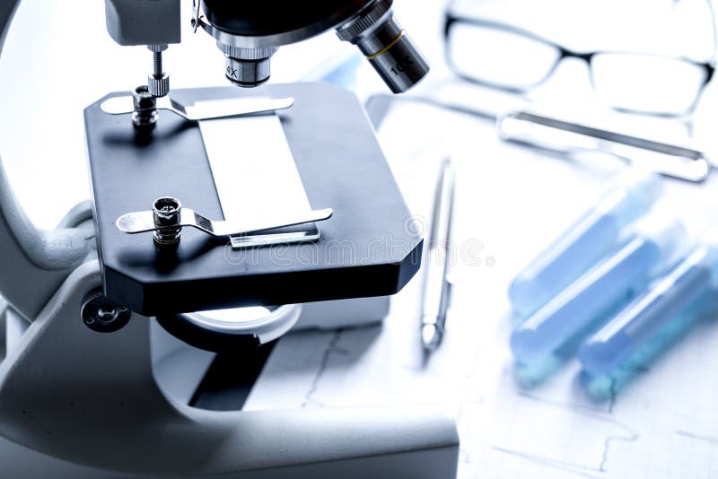 Doctors Desk with Microscope and Test Tubes Stock Photo - Image of ...