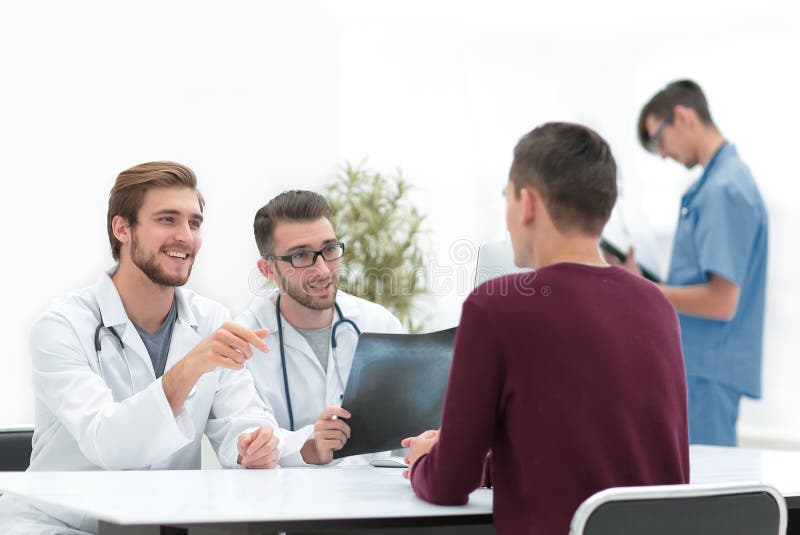 Doctors Discuss with the Patient the X-ray Stock Photo - Image of ...
