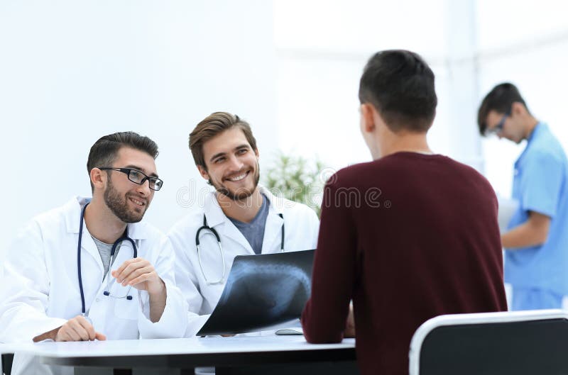 Doctors Discuss with the Patient the X-ray Stock Image - Image of ...
