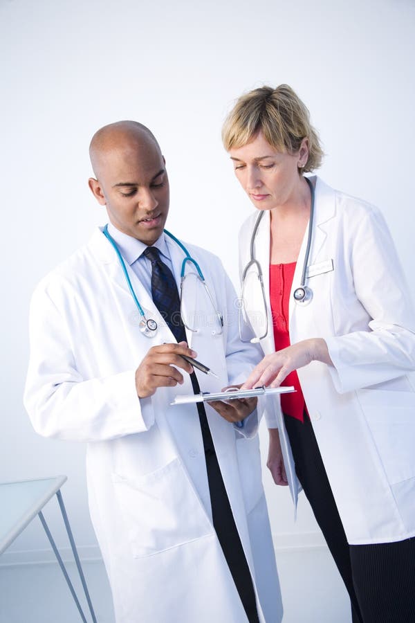 Doctors discussing stock photo. Image of hospital, discussion - 5645564