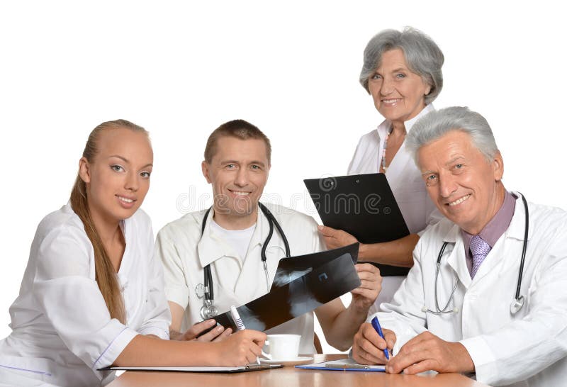 Doctors Discussing at Table Stock Photo - Image of caucasian ...