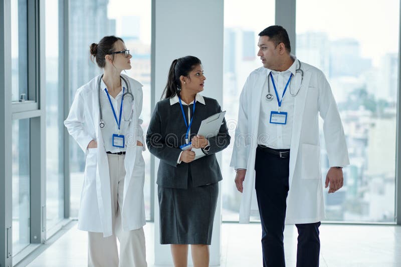 Doctors Discussing Working Moments with Manager Stock Image - Image of ...