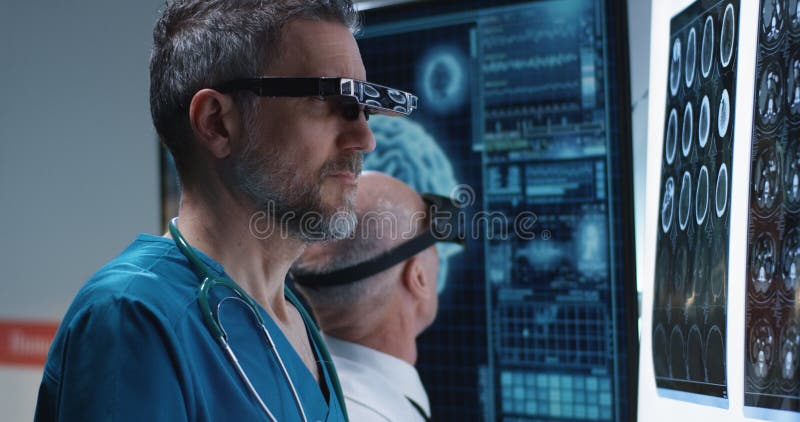 Doctors Examining Brain Scan with VR Headset Stock Photo - Image of ...