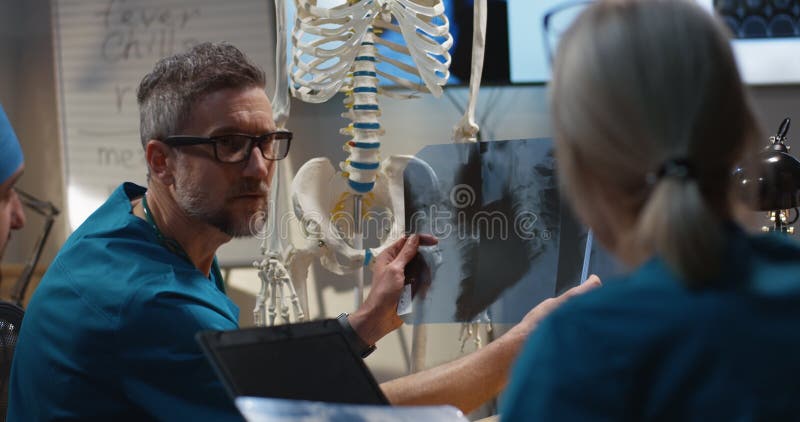Doctors Examining Cervical Spine X-ray Stock Image - Image of indoors ...