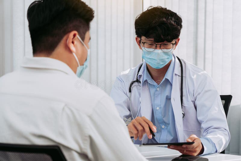 Doctors are Explaining the Treatment of a Sick Patient in Tablets while ...