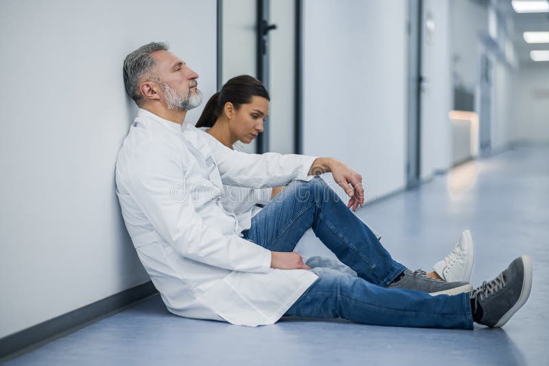 Doctors Feeling Exhausted after the Hard Shift Stock Photo - Image of ...