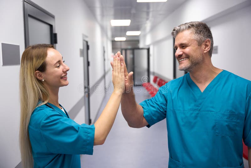 Doctors Give High Five To Each Other Stock Image - Image of ...