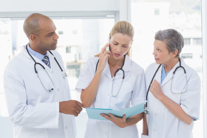 Doctors Having an Important Phone Call Stock Image - Image of indoors ...