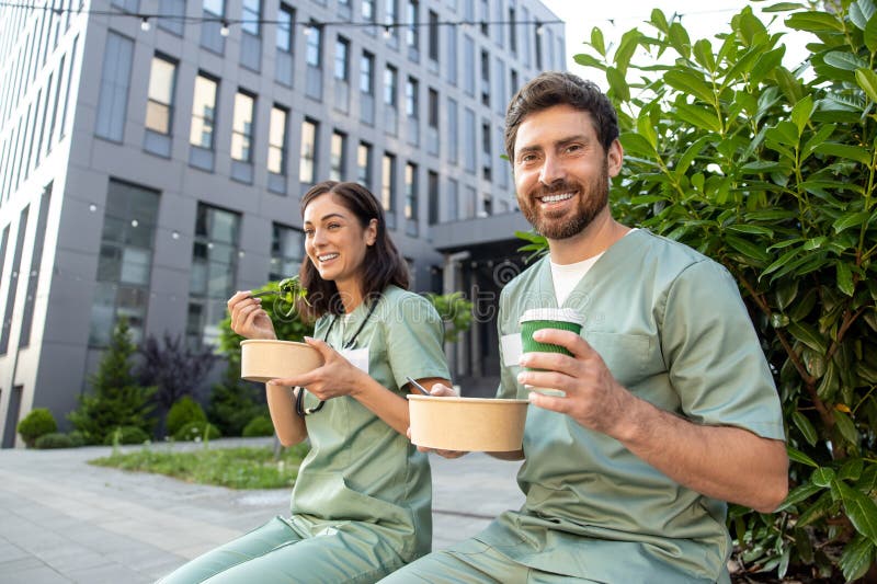 Doctors Having Lunch Together and Looking Positive and Smiling Stock ...