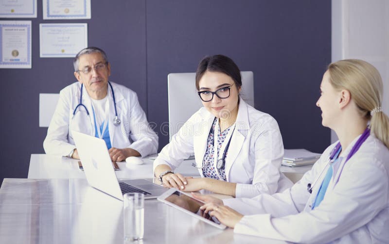 Doctors Having a Medical Discussion in a Meeting Room Stock Photo ...