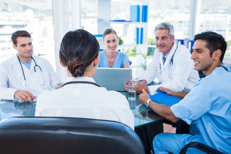 Doctors having a meeting stock image. Image of communication - 56482179