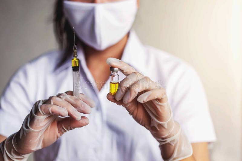 Doctors Hold Syringes and Vaccines in Hand Stock Image - Image of ...