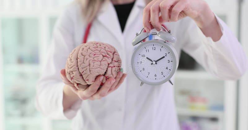 Doctors Holding an Alarm Clock and Brain Mockup Stock Video - Video of ...