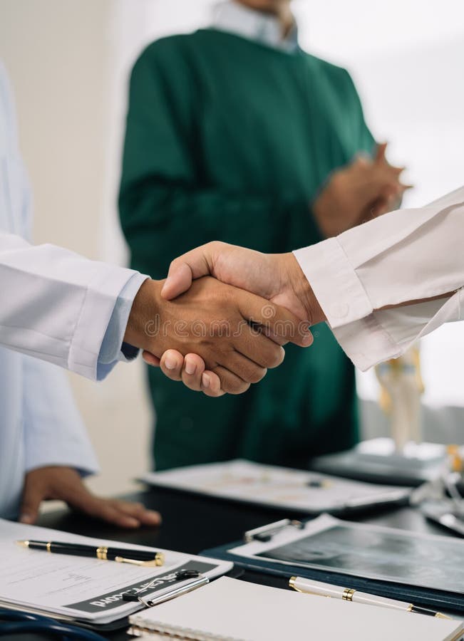 Doctors Holding Hands Together at Hospital Stock Image - Image of ...