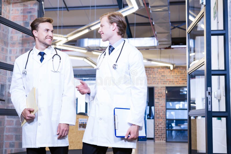 Doctors Interacting with Each Other Stock Image - Image of indoors ...
