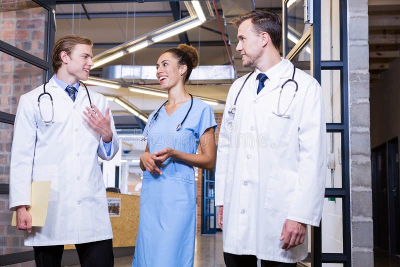 Doctors Interacting with Each Other Stock Photo - Image of happy ...