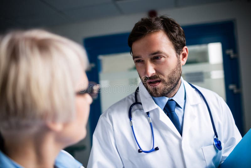 Doctors Interacting with Each Other Stock Image - Image of spectacles ...