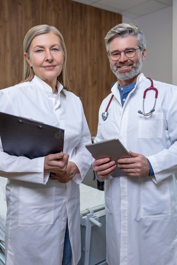 Doctors in Lab Coats Standing Close and Looking Confident Stock Image ...