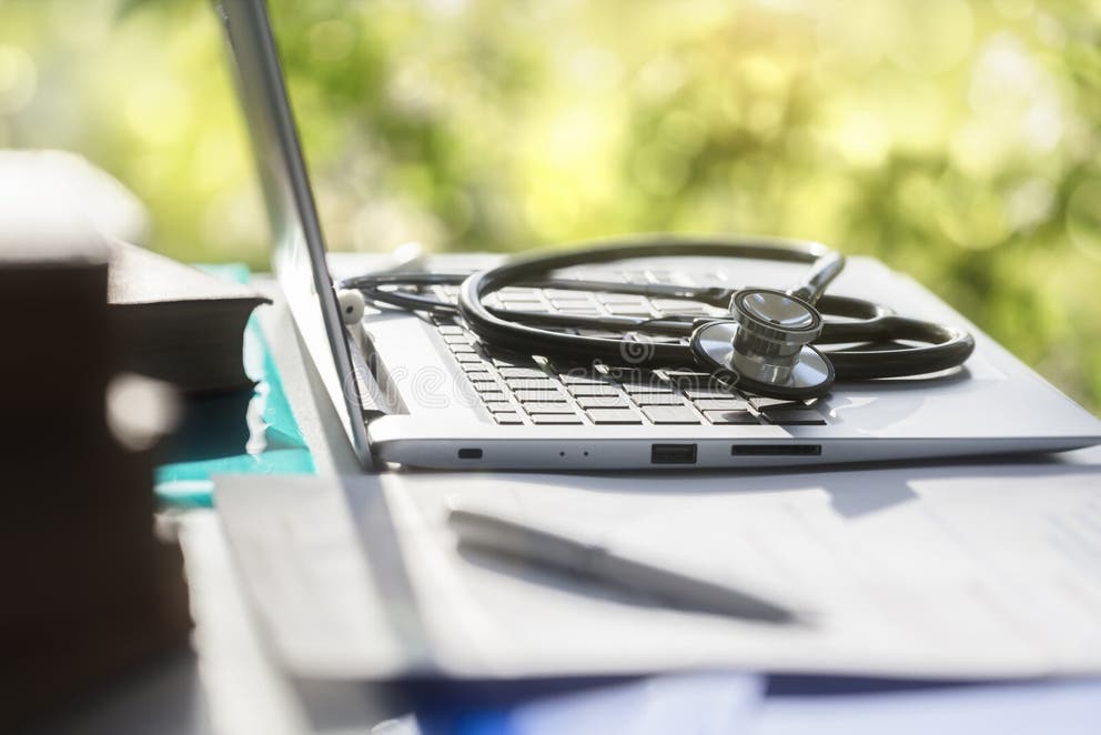 Doctors Laptop Computer and Stethoscope in Surgery Stock Image - Image ...