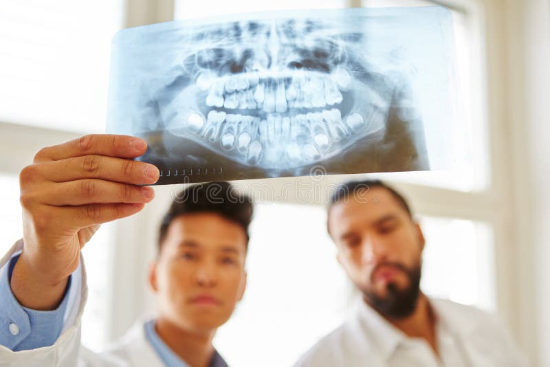 Doctors Looking Ad X-ray Image Stock Photo - Image of surgery ...