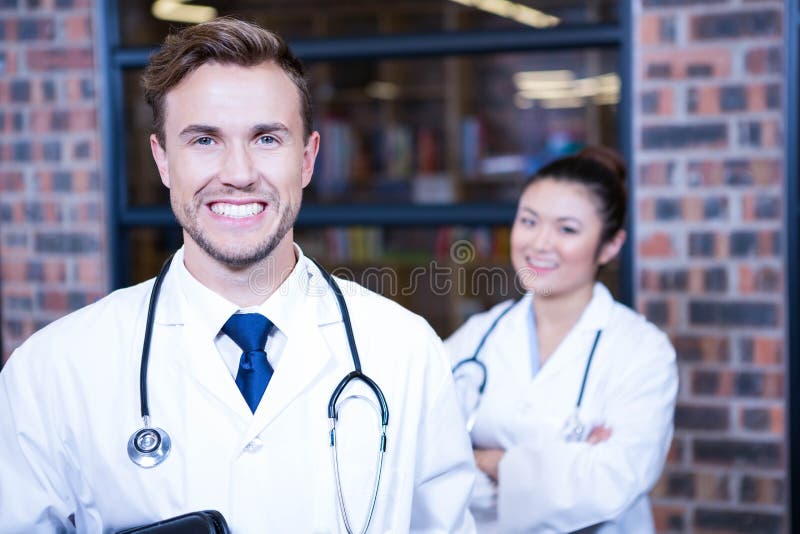 Doctors Looking at Camera and Smiling Stock Image - Image of care ...
