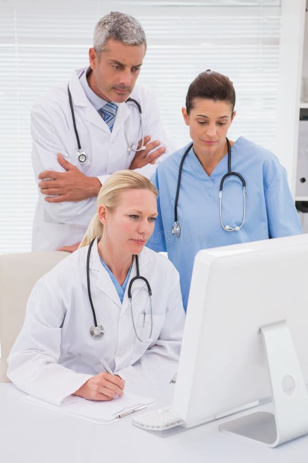 Doctors Looking at Computer Stock Image - Image of monitor, health ...
