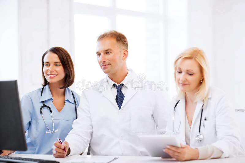 Doctors Looking at Computer on Meeting Stock Photo - Image of ...