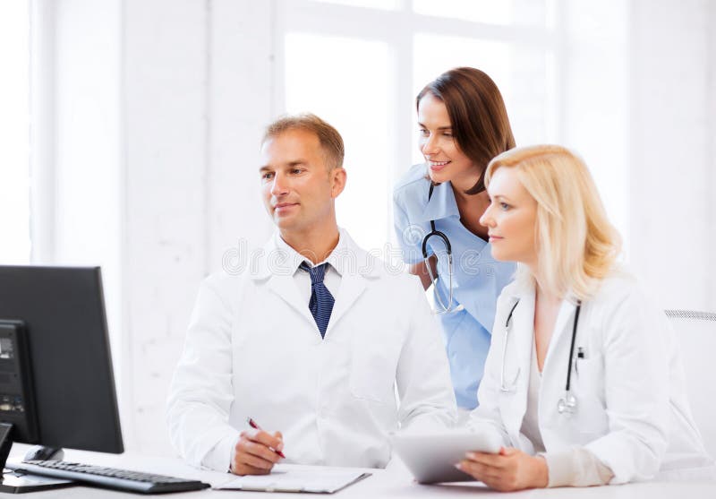 Doctors Looking at Computer on Meeting Stock Image - Image of docs ...