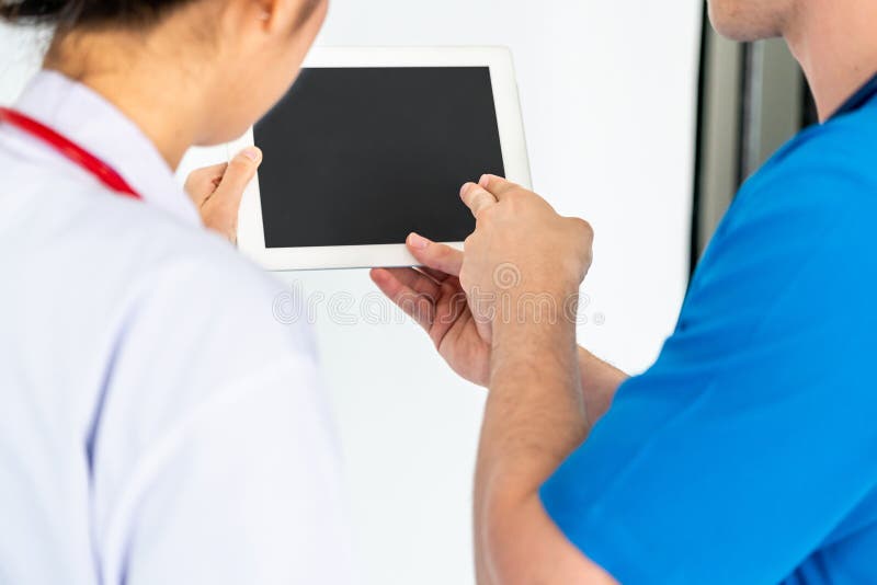 Doctors Looking at Data on Computer at Hospital. Stock Image - Image of ...