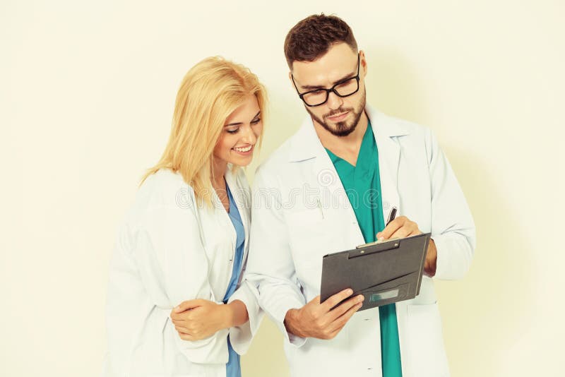 Doctors Looking and Discussing on Documents Paper. Stock Photo - Image ...