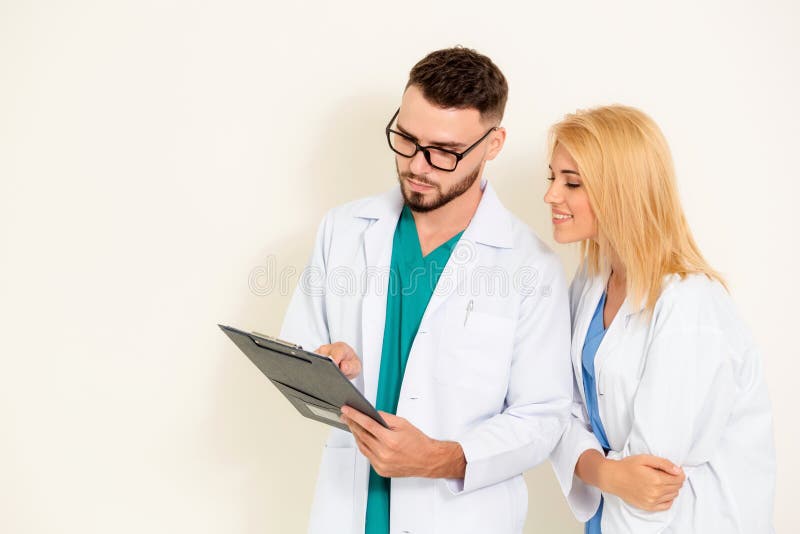 Doctors Looking and Discussing on Documents Paper. Stock Image - Image ...