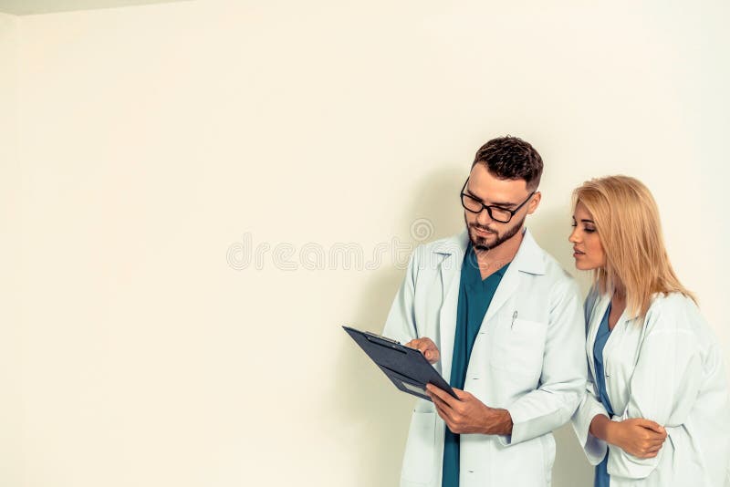 Doctors Looking and Discussing on Documents Paper. Stock Photo - Image ...