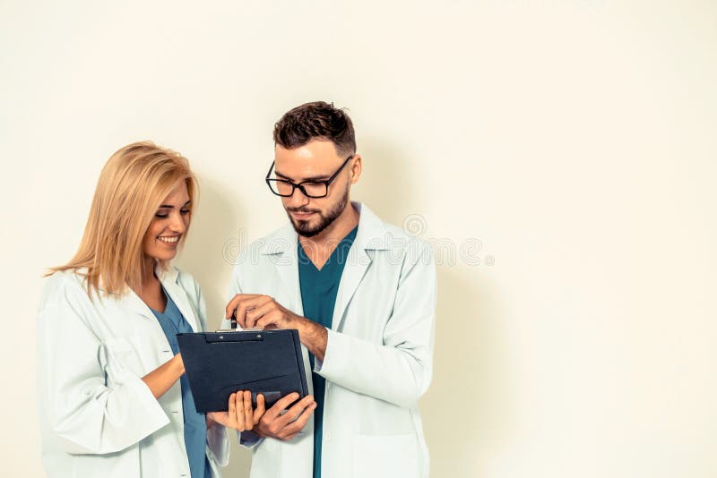 Doctors Looking and Discussing on Documents Paper. Stock Photo - Image ...