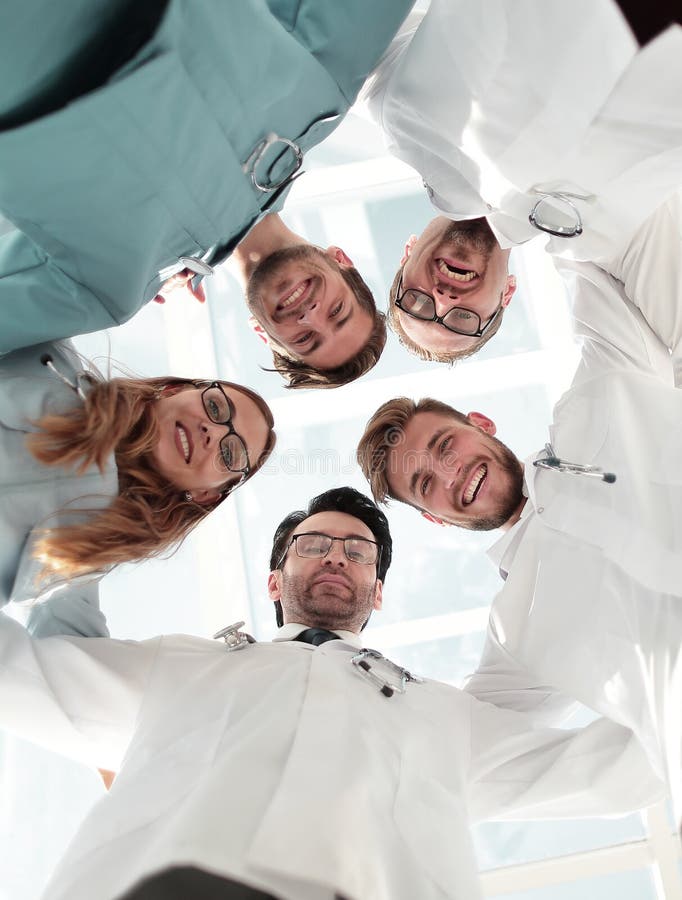 Doctors Looking Down Smiling at the Camera Stock Photo - Image of ...