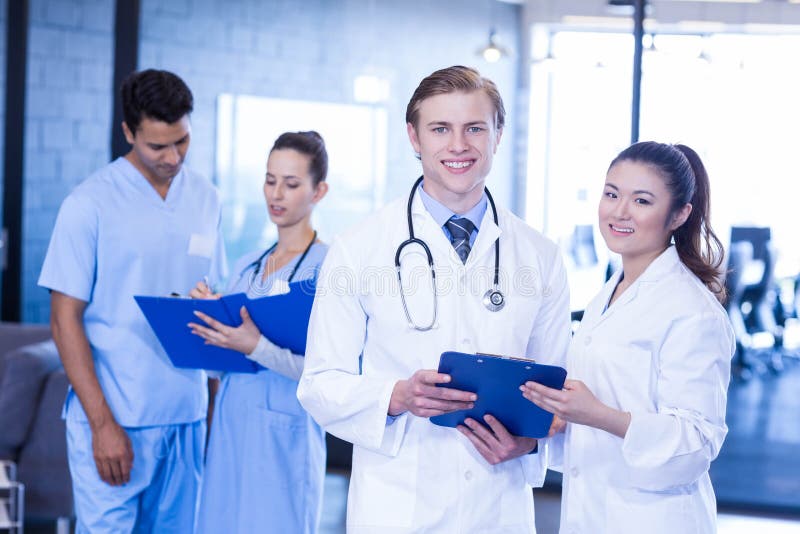 Doctors Looking at Medical Report Stock Photo - Image of adult, health ...