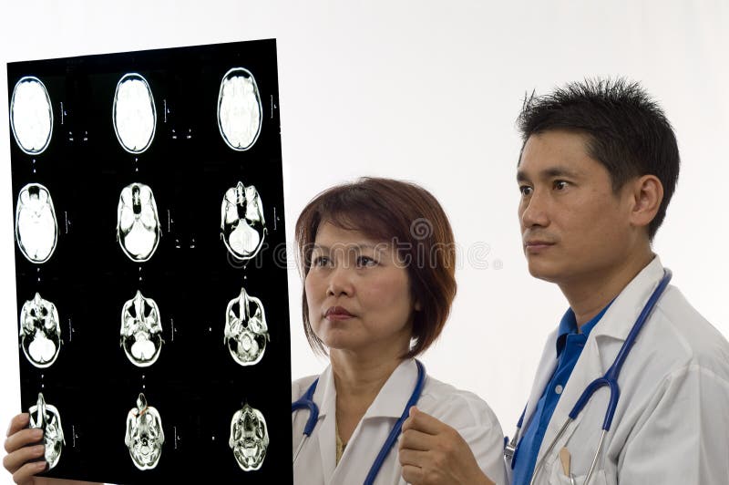 Doctors looking at MRI stock photo. Image of check, male - 15377422