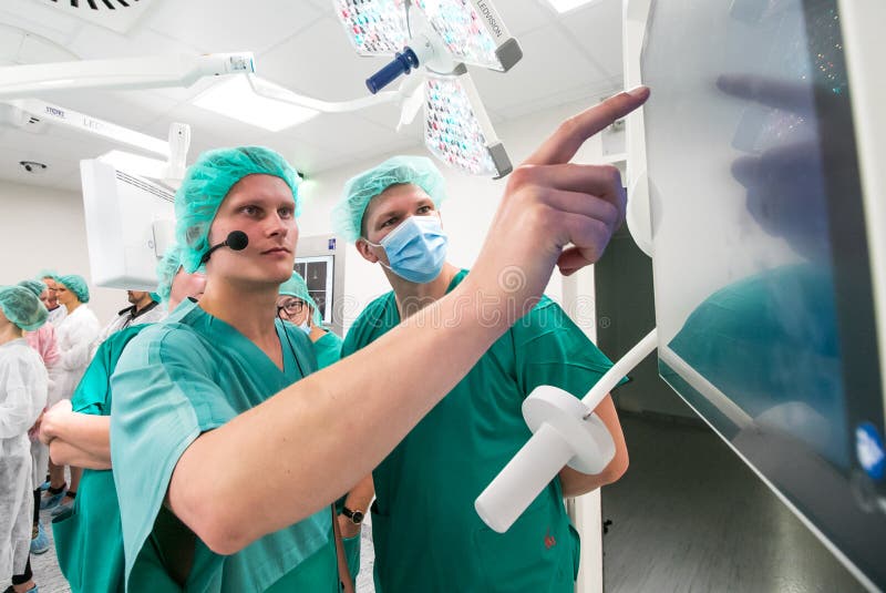 Doctors Looking into the Screen in Surgery Room Editorial Photo - Image ...