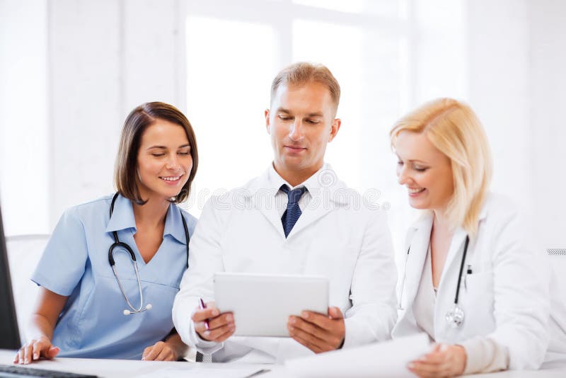 Group of Doctors Looking at Tablet Pc Stock Photo - Image of doctors ...