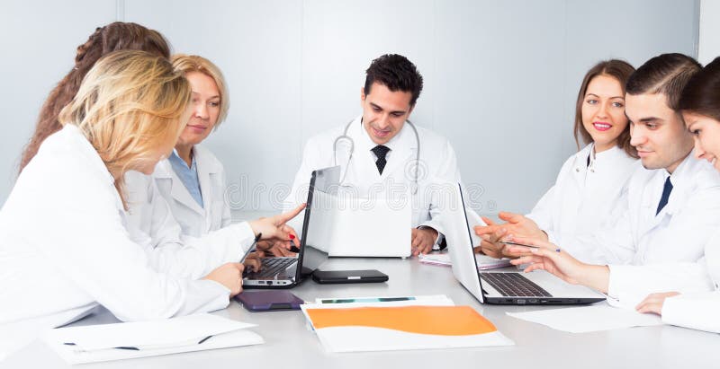 Doctors in Negotiations in Conference Room Stock Image - Image of group ...
