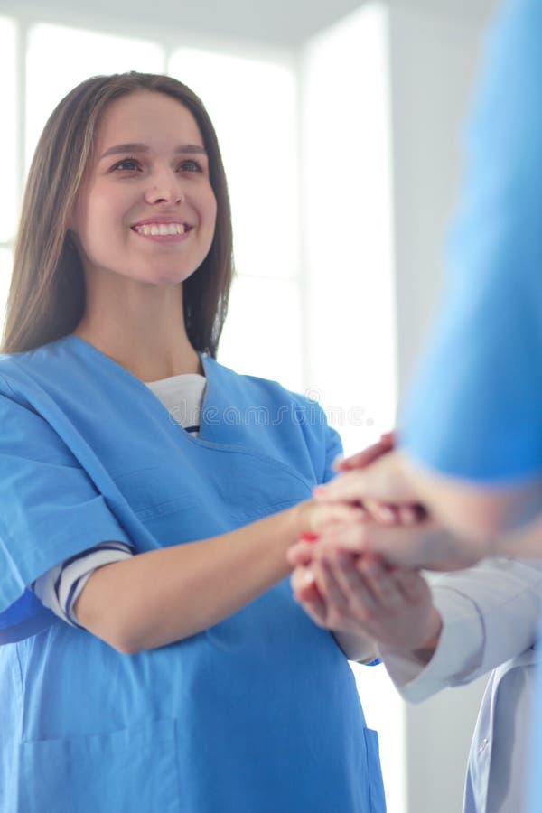 Doctors and Nurses in a Medical Team Stacking Hands Stock Photo - Image ...