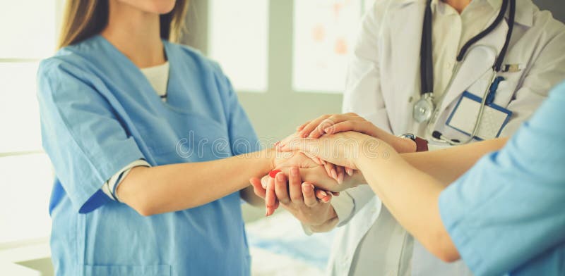 Doctors and Nurses in a Medical Team Stacking Hands Stock Image - Image ...