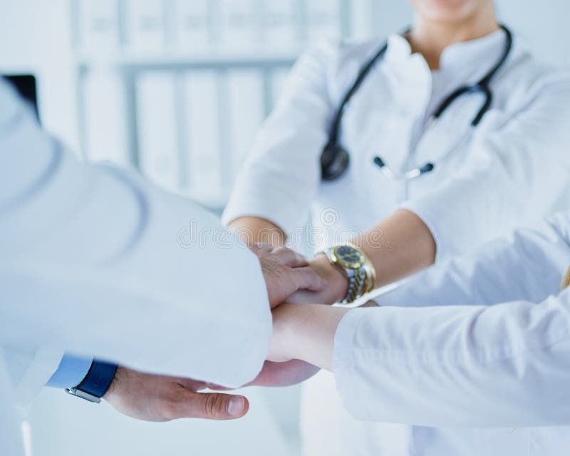 Doctors and Nurses in a Medical Team Stacking Hands Stock Image - Image ...