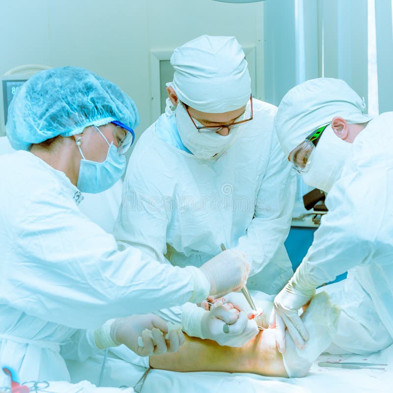 Doctors Operate on a Patient Stock Photo - Image of doctor, treatment ...