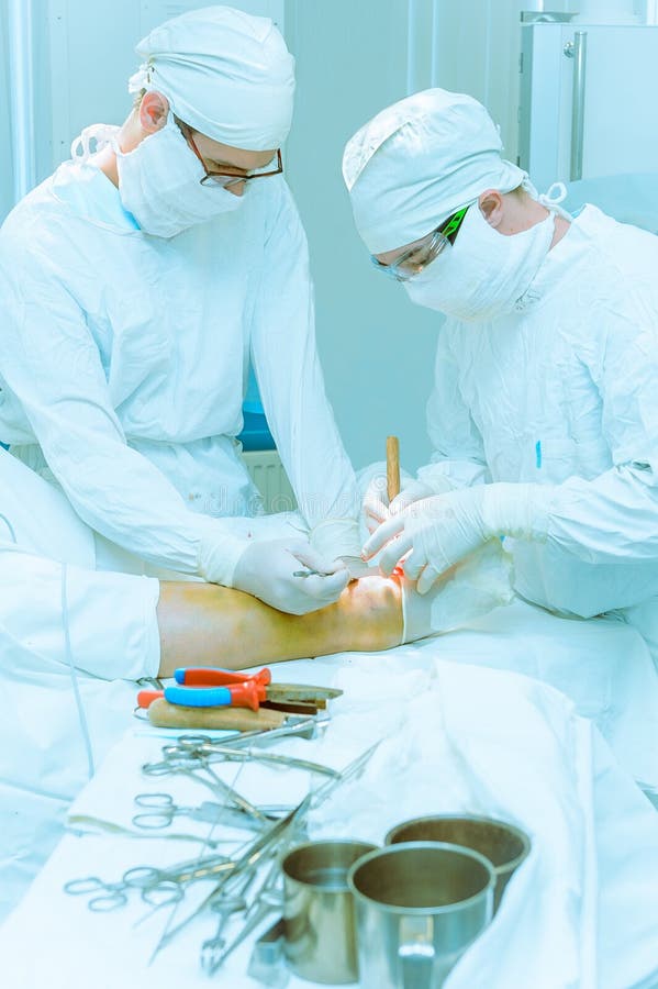 Doctors Operate on a Patient Stock Photo - Image of doctor, treatment ...