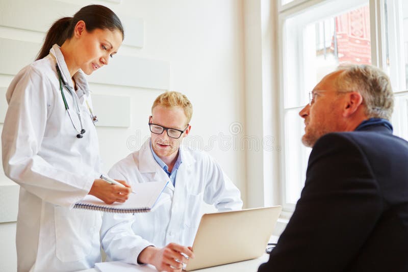 Patient Talking with Doctors Assistant at Reception Stock Image - Image ...