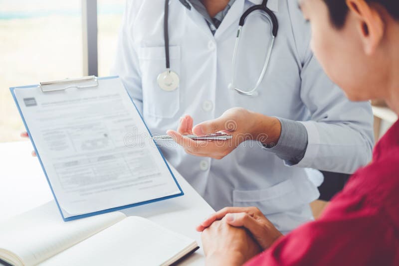 Doctors and Patients Sit and Talk. at the Table Near the Window Stock ...