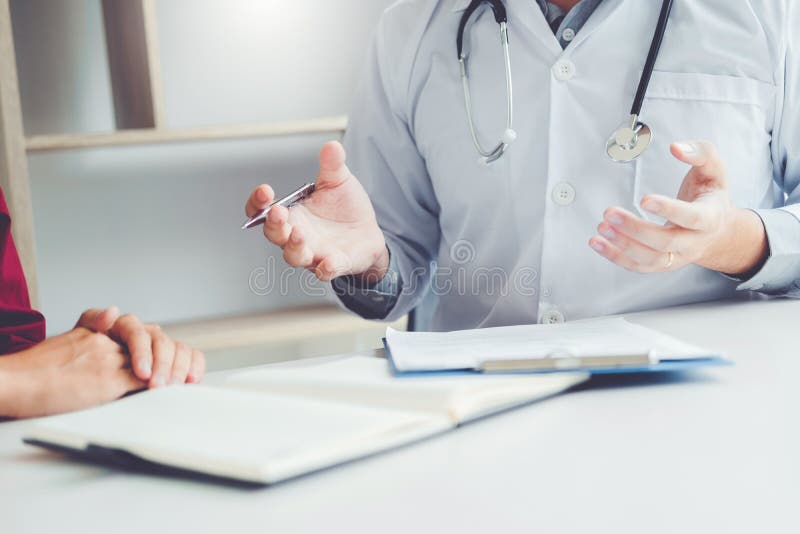 Doctors and Patients Sit and Talk. at the Table Near the Window Stock ...